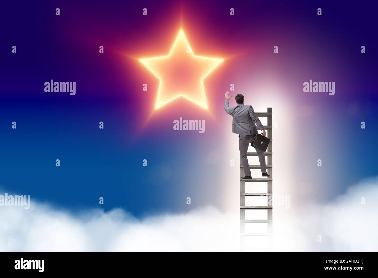 The businessman reaching out for stars Stock Photo - Alamy