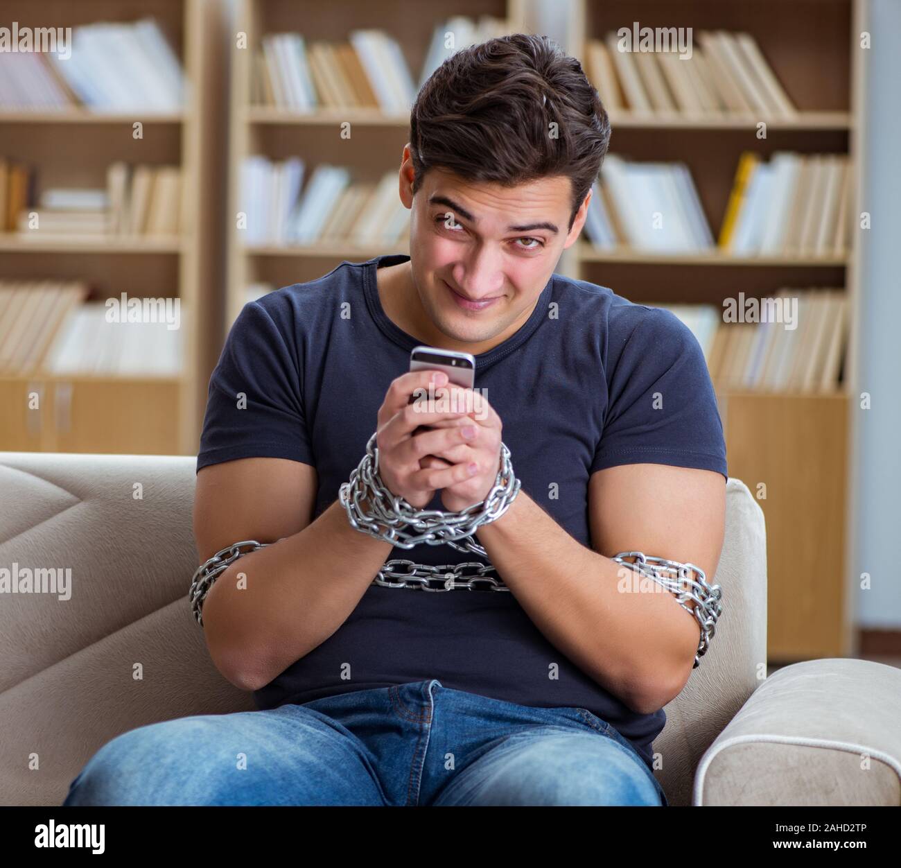 The man suffering from phone dependence addiction Stock Photo - Alamy