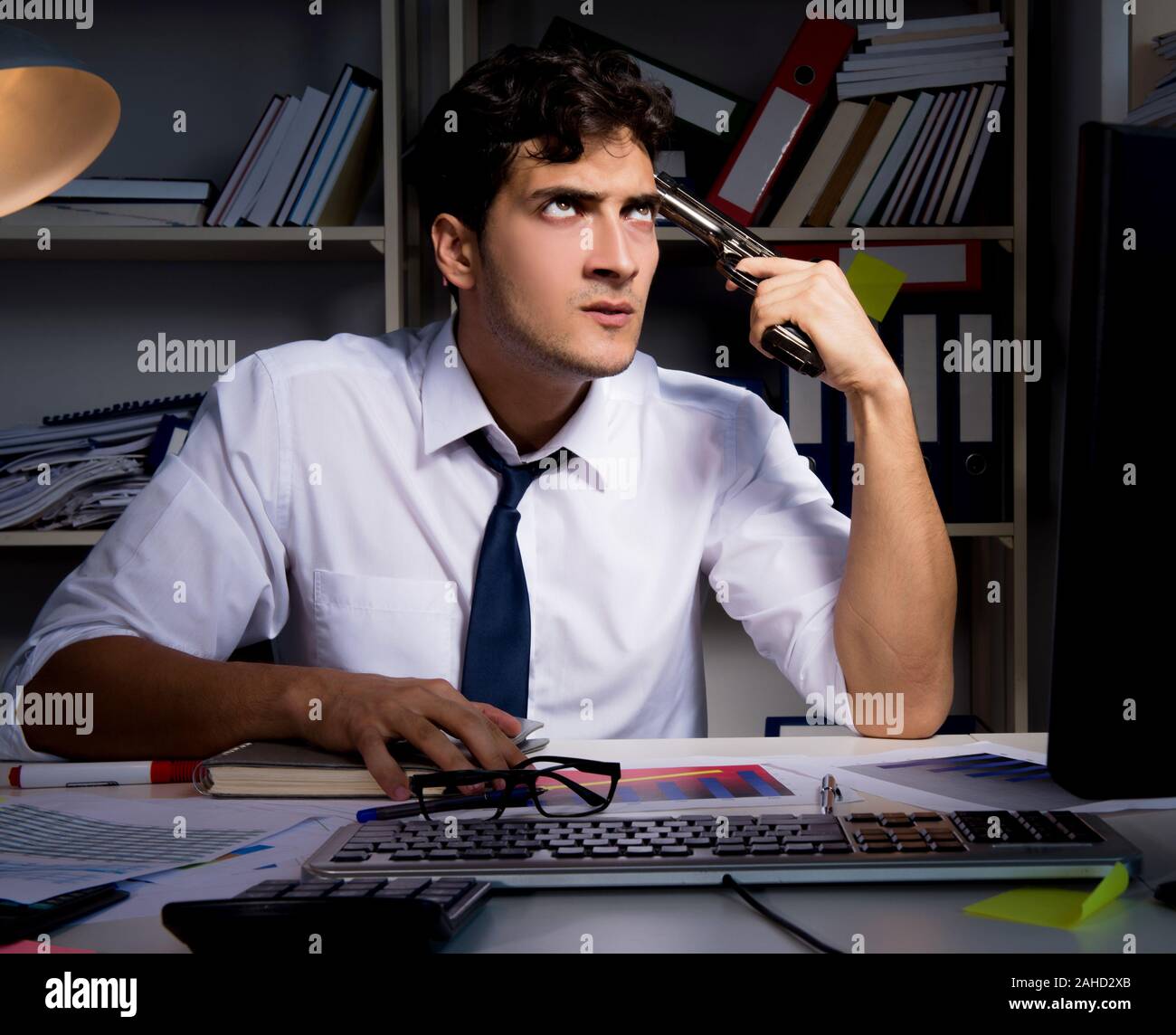 The man businessman working late hours in the office Stock Photo - Alamy