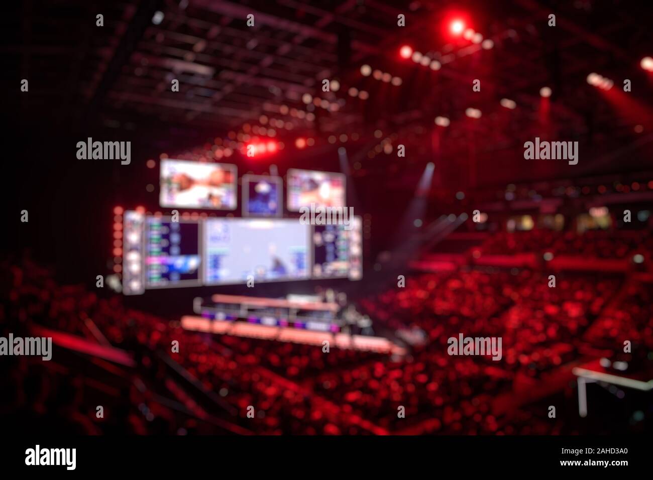 Blurred background of an esports event - Big illuminated main stage of ...