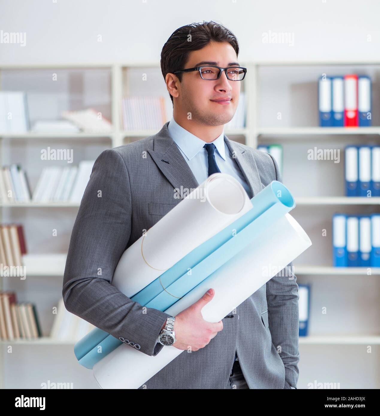 The businessman engineer draftsman with blueprints drawings Stock Photo ...