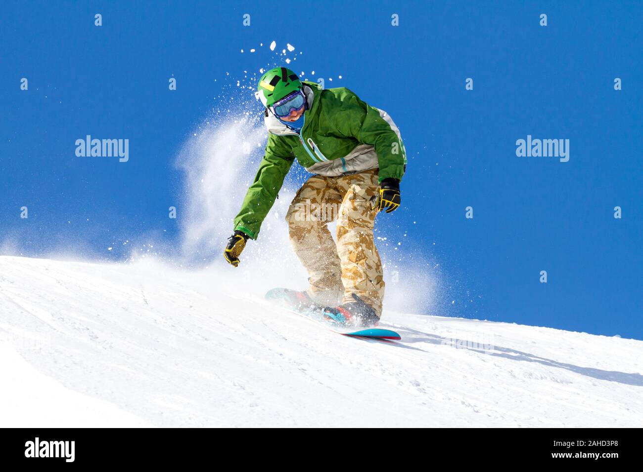 downhill with snowboards in fresh snow Stock Photo - Alamy