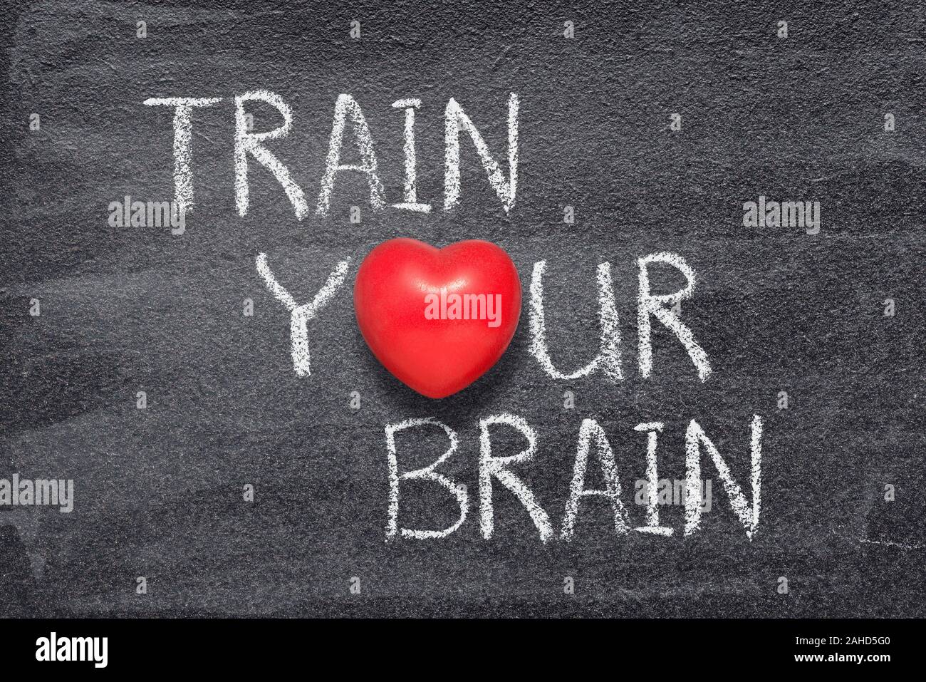 train your brain phrase written on chalkboard with red heart symbol ...