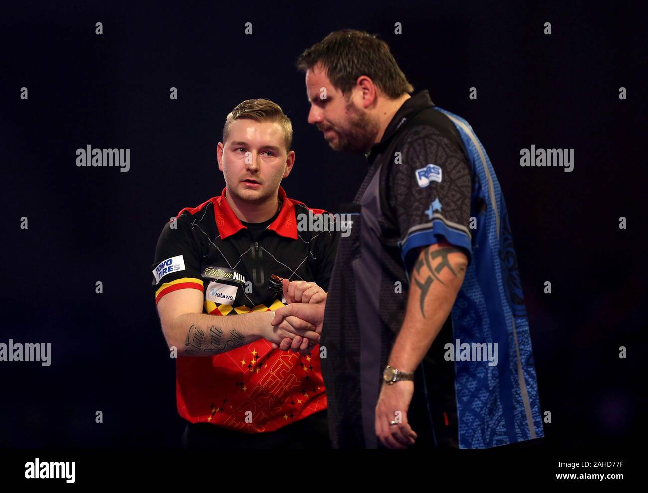 Dimitri Van den Bergh shakes hands with Adrian Lewis after winning ...