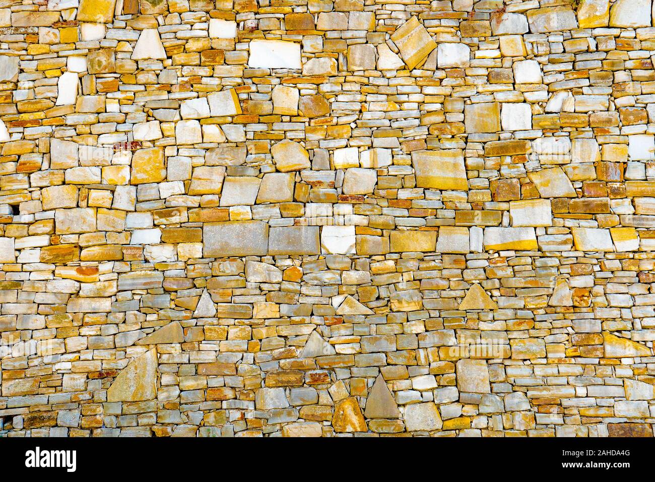 Surface with asymmetrical stones. Wall of a medieval fortress. Wall ...