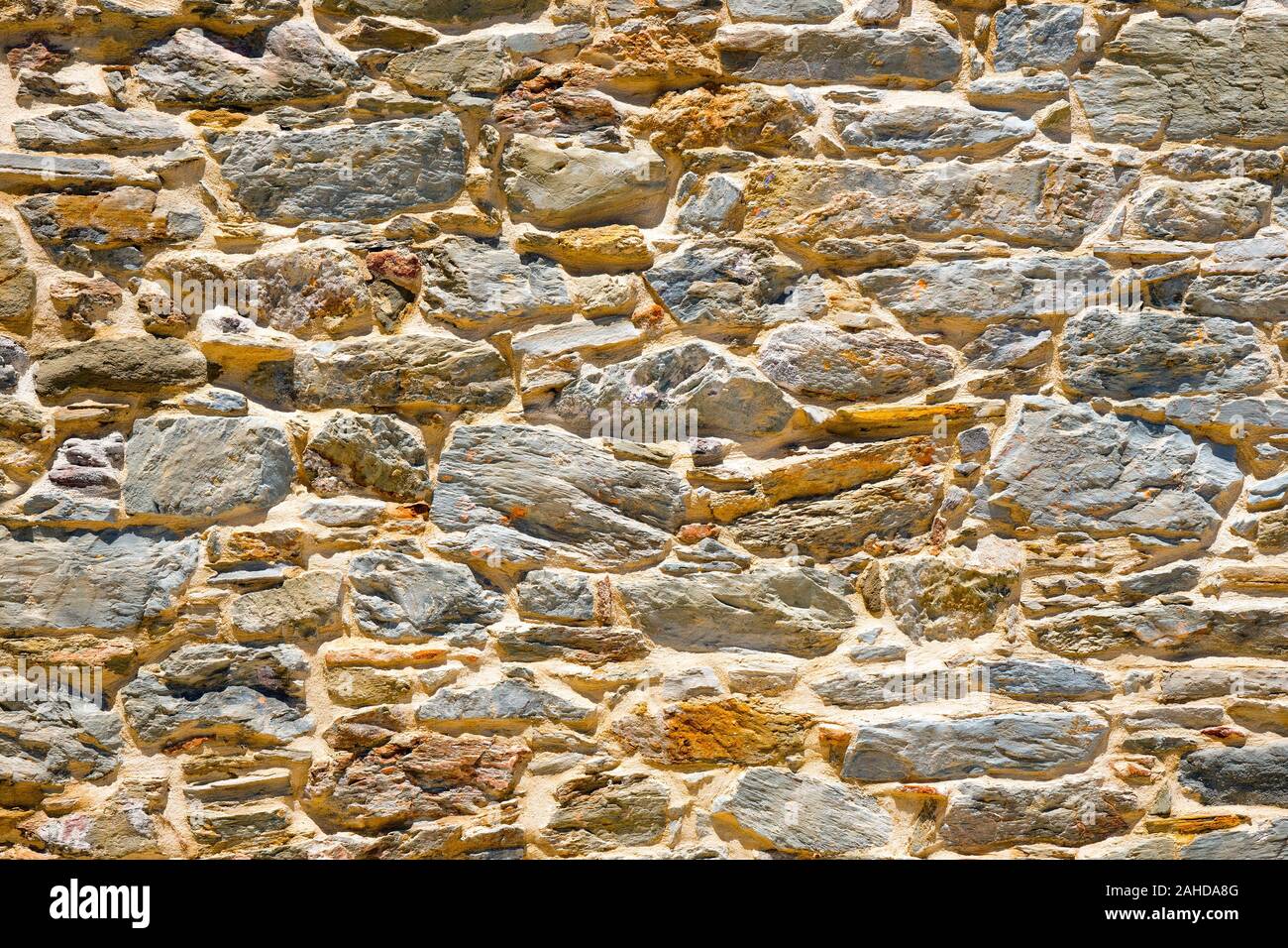 Surface with asymmetrical stones. Wall pattern texture background. Old ...