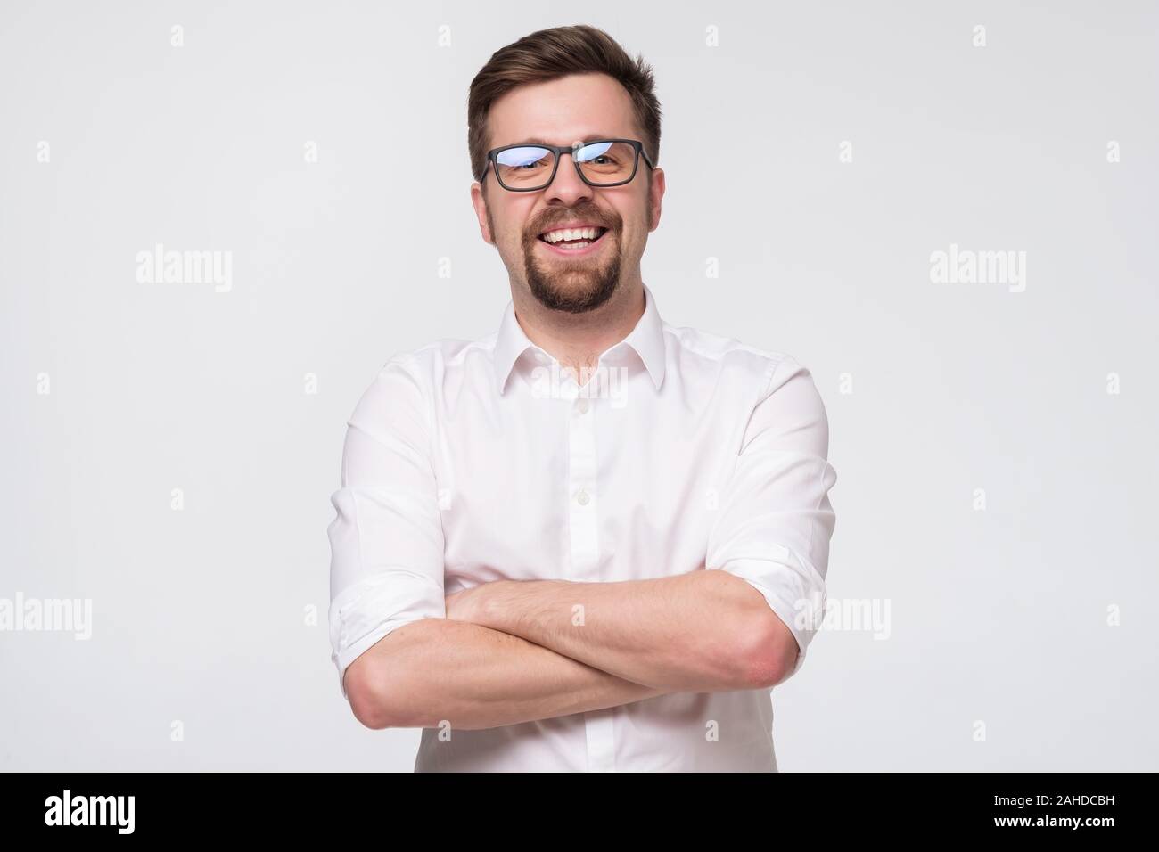 Handsome european businessman in white formal shirt and black tie ...