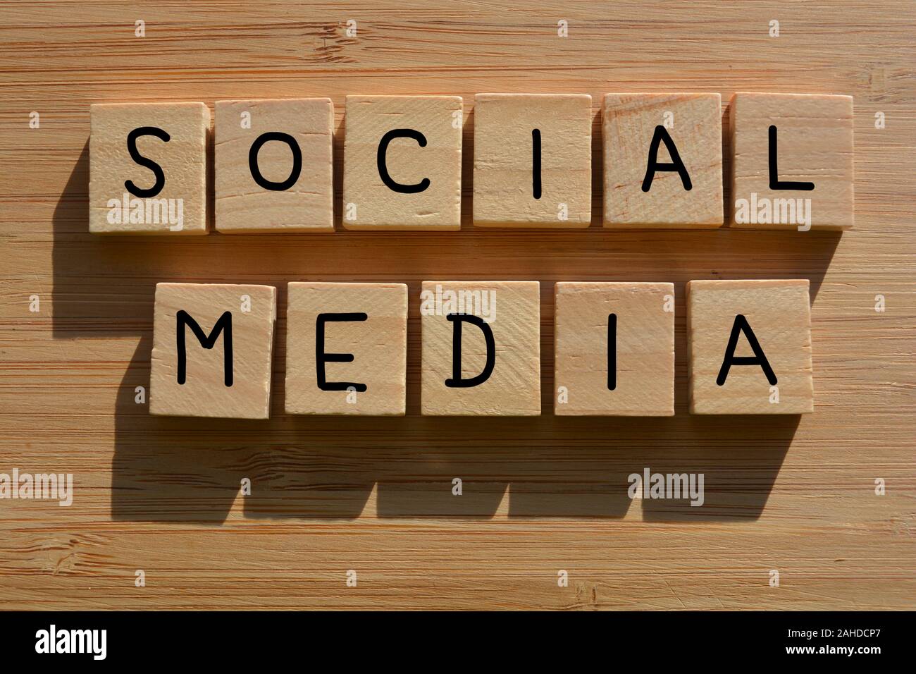 Social Media, words in 3d wooden alphabet letters on a wood background ...