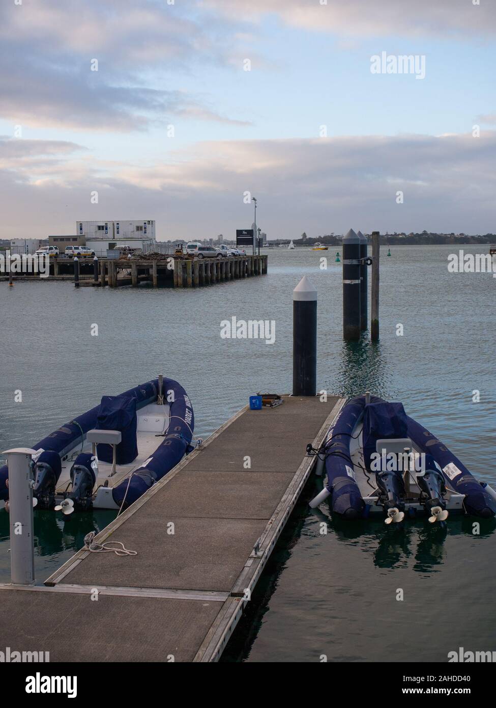 Small boats moored by the jetty hi-res stock photography and images - Alamy