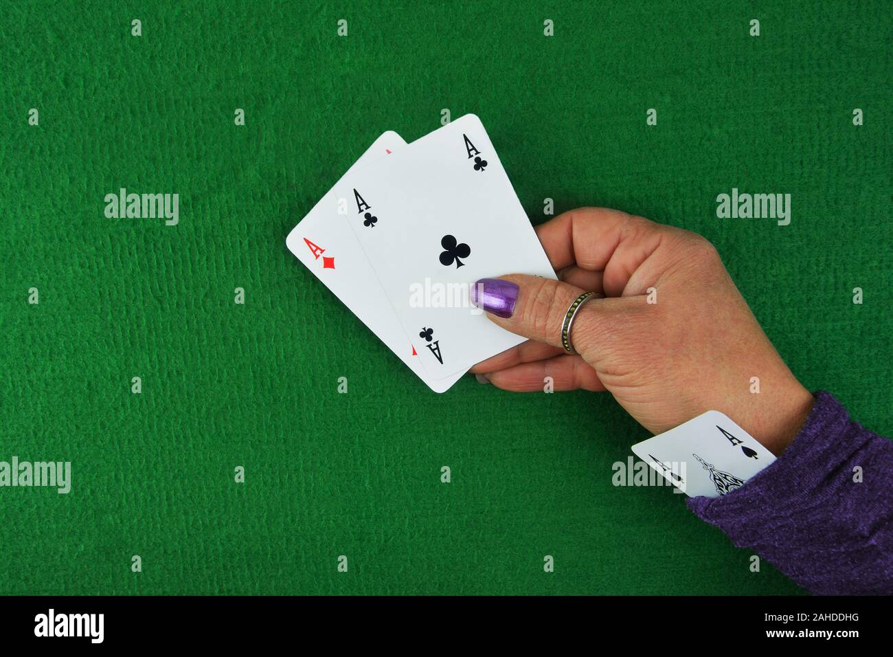 Woman's hand have ace up sleeve Stock Photo - Alamy