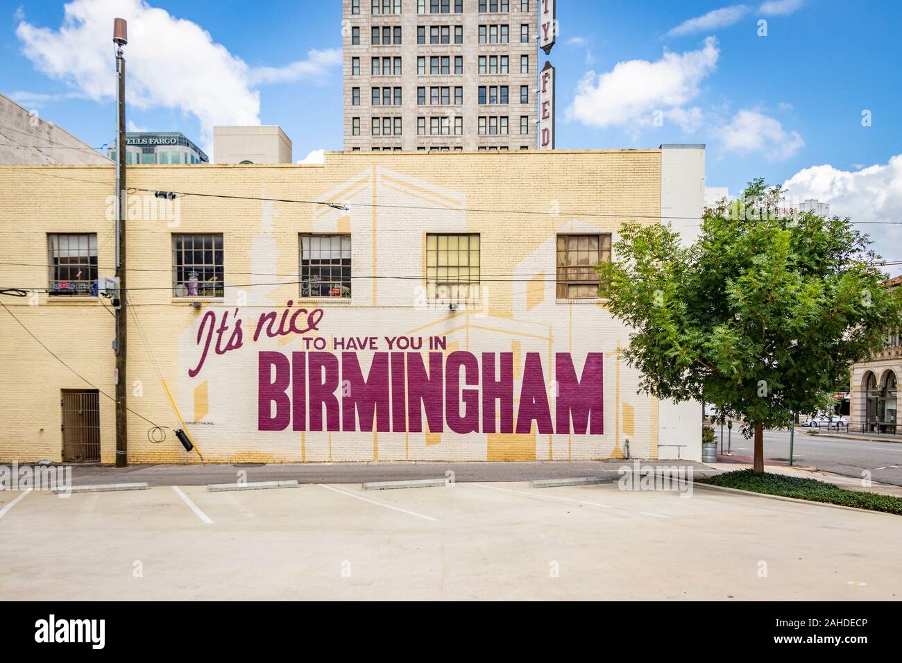 painted wall sign announcing its nice Birmingham in front of the City ...
