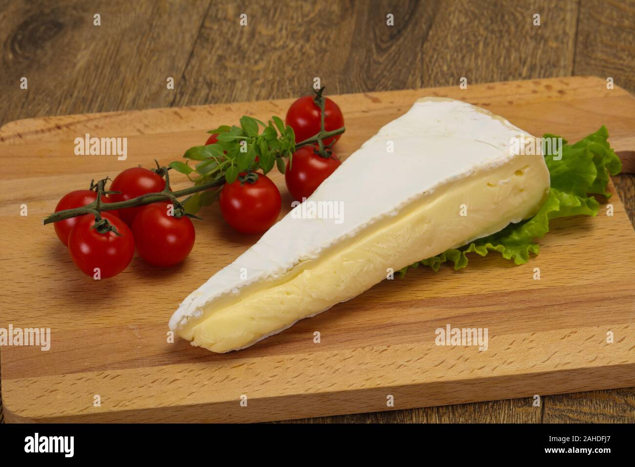 Brie cheese triangle served salad leaves Stock Photo - Alamy