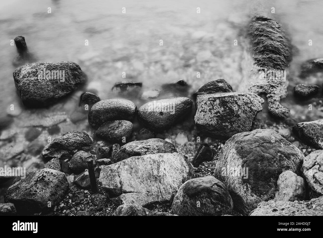 rocks in water, black and white Stock Photo - Alamy