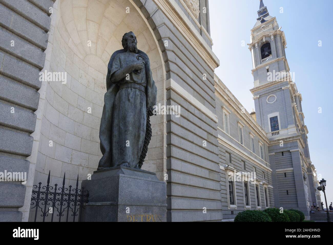 Statue of St Peter holding a key in front of the Almudena Cathedral ...