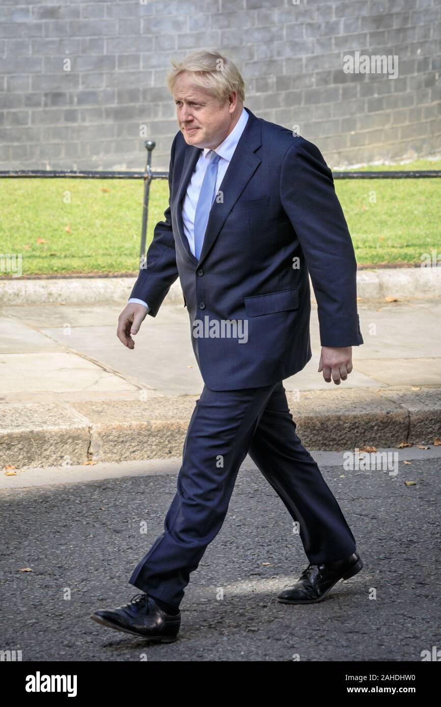 Prime Minister Boris Johnson walks outside No 10 Downing Street ...