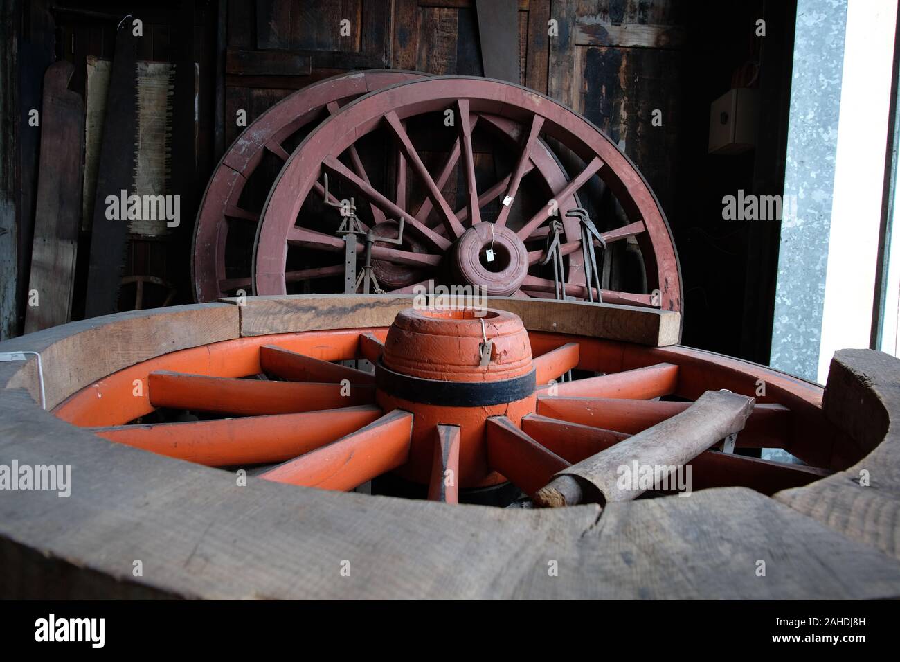 Vintage wagon and cart wheels in a repair shop Stock Photo - Alamy