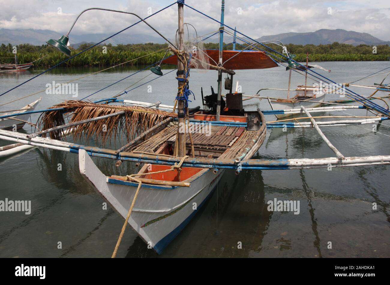 Bankas, traditional outrigger wooden boats used by artisanal fishermen ...