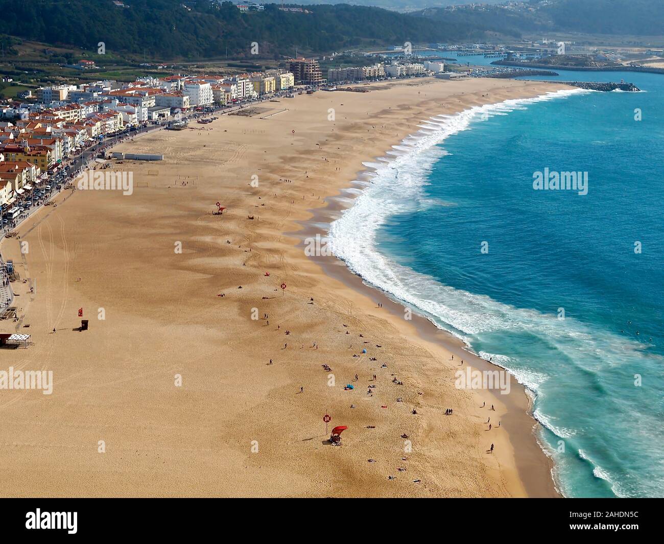 Aerial view of Nazare at the Centro coast of Portugal with long beach ...