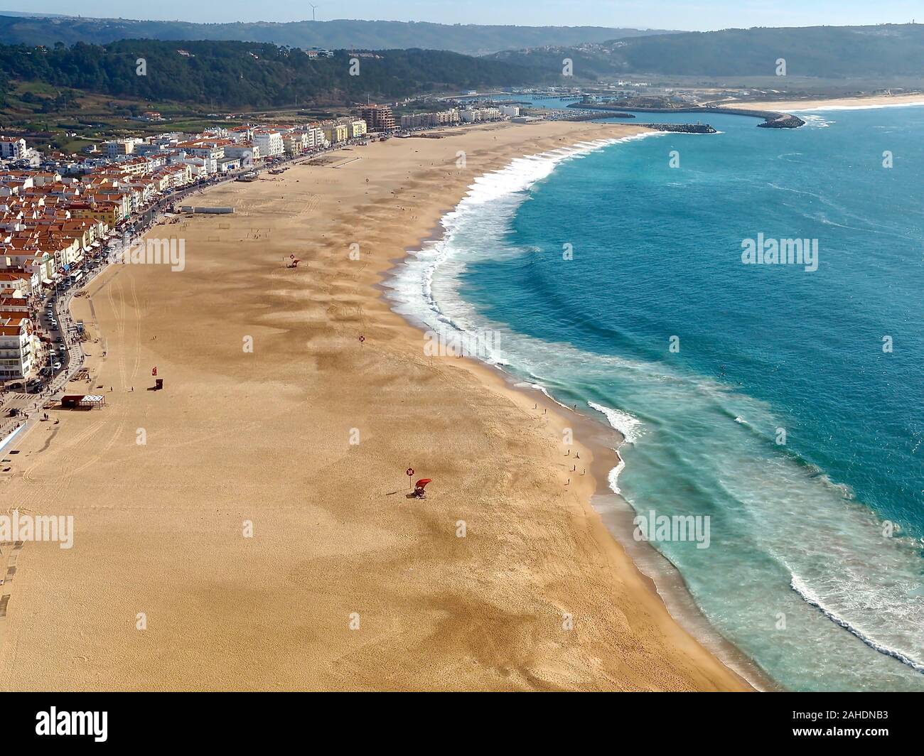 Aerial view of Nazare at the Centro coast of Portugal with long beach ...