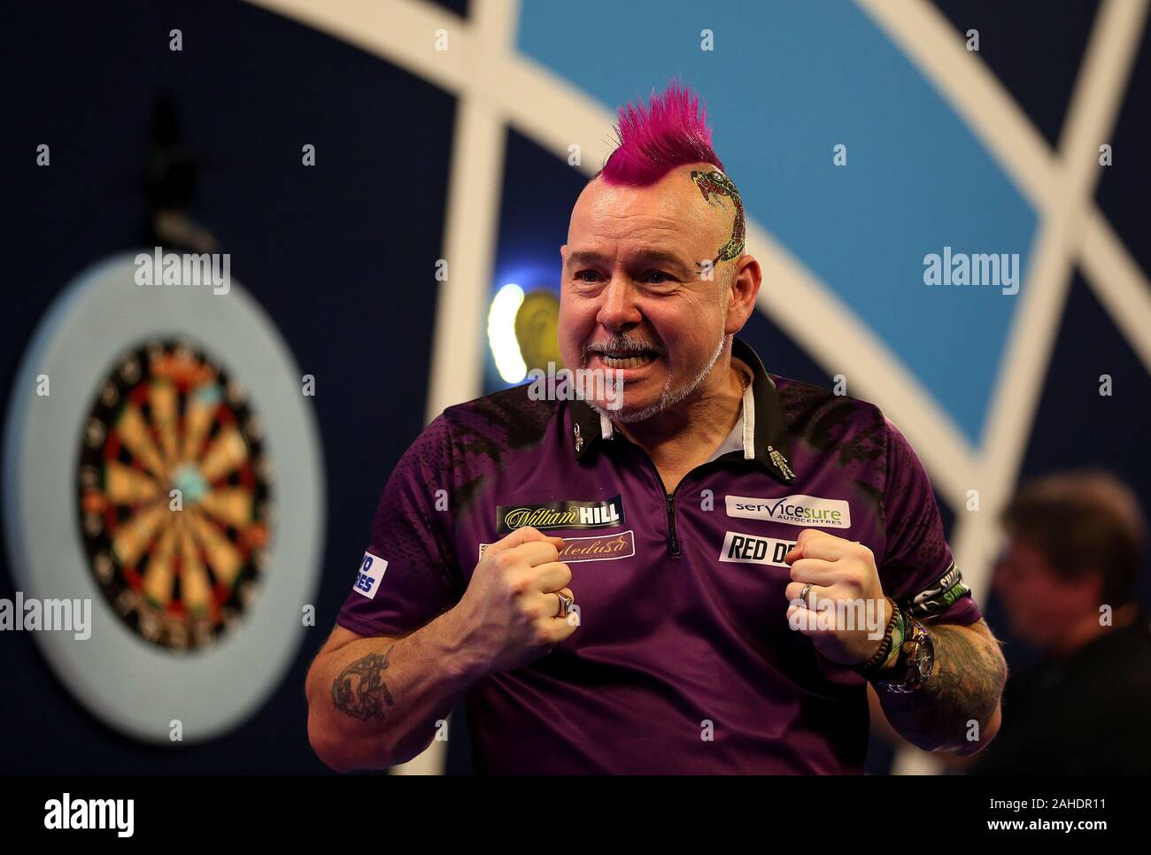 Peter Wright celebrates winning during day thirteen of the William Hill ...