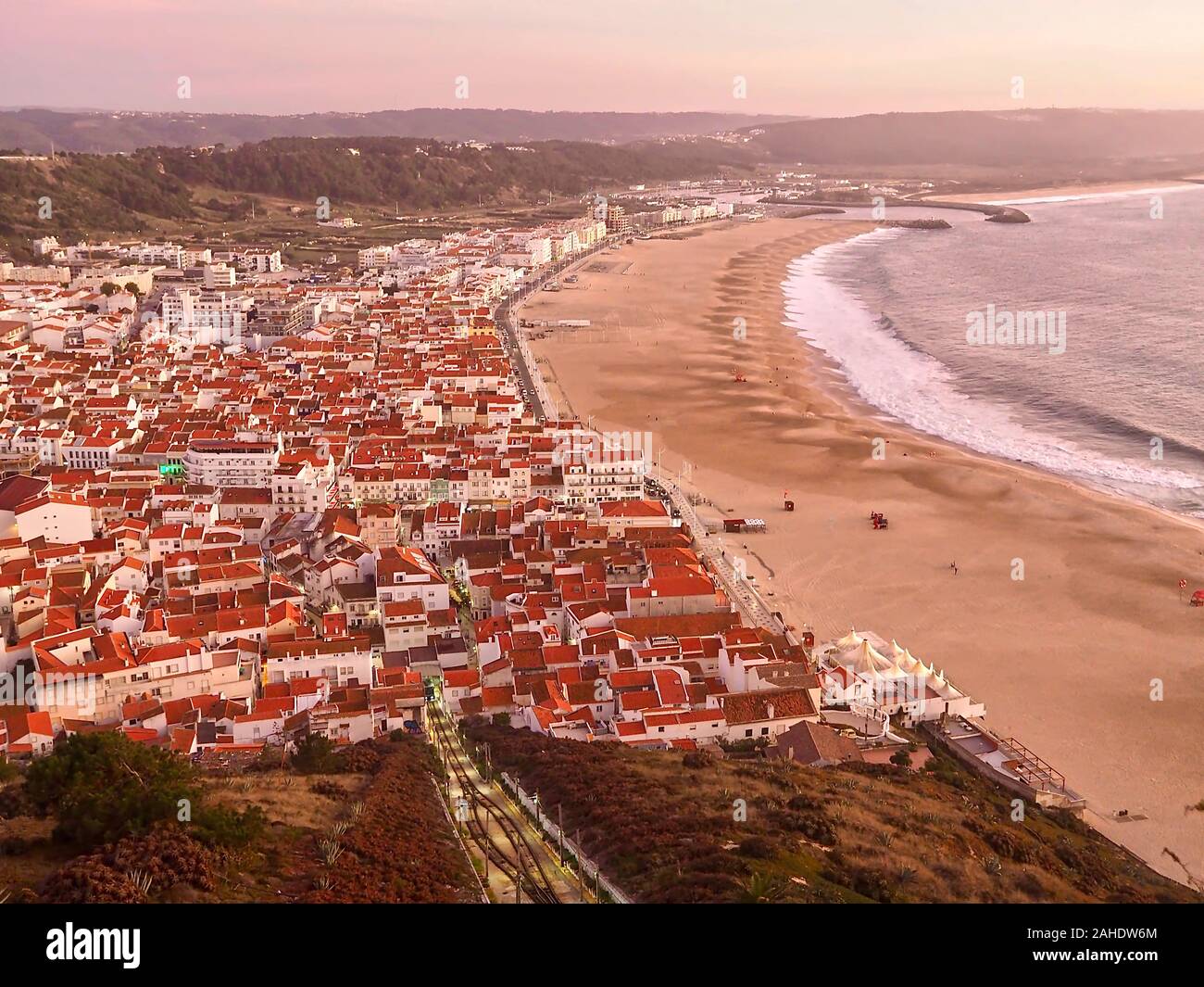 Aerial view of Nazare at the Centro coast of Portugal with long beach ...