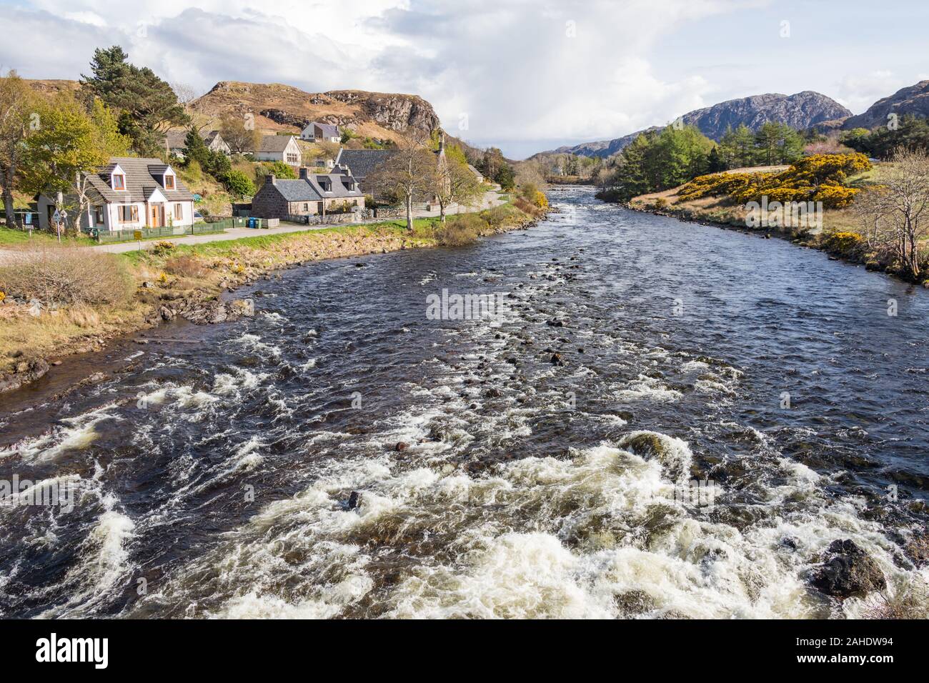 The village of Poolewe, Wester Ross, with the River Ewe flowing through ...
