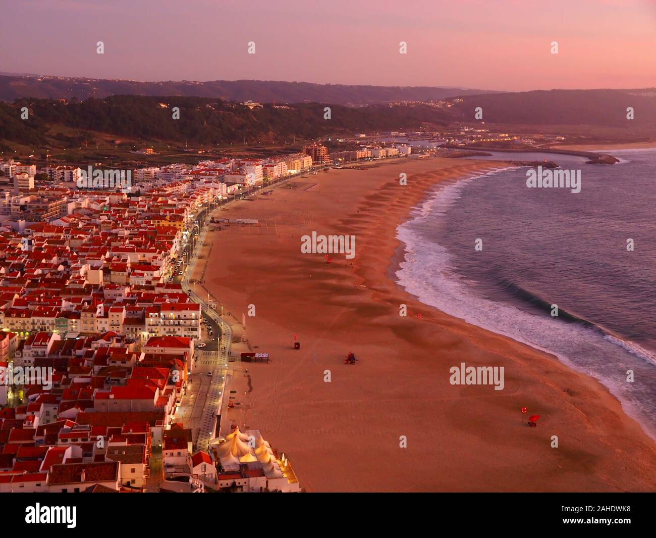 Aerial view of Nazare at the Centro coast of Portugal with long beach ...