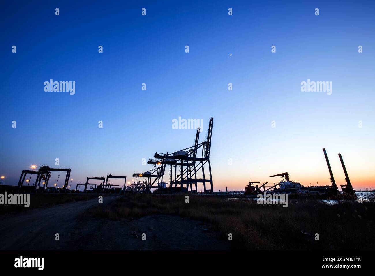 Container terminal in the evening Stock Photo - Alamy