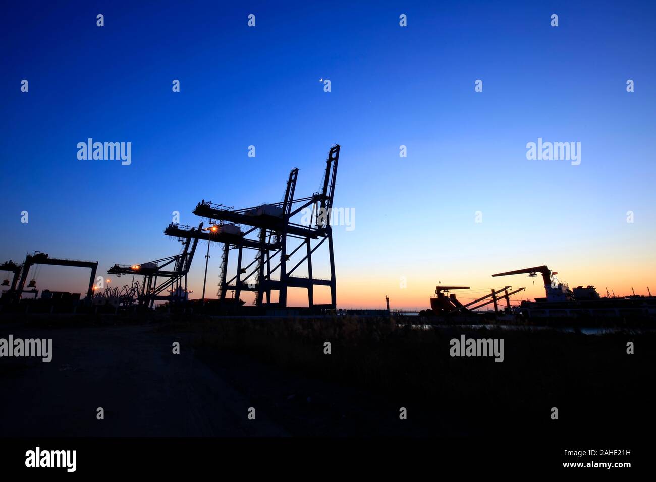 Container terminal in the evening Stock Photo - Alamy