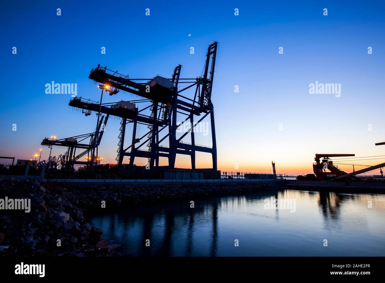 Container terminal in the evening Stock Photo - Alamy