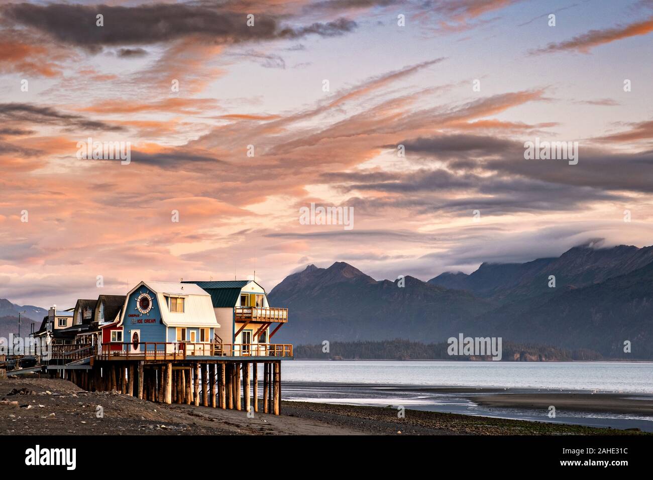 Sunset over the shops and restaurants on Homer Spit along the Kachemak ...