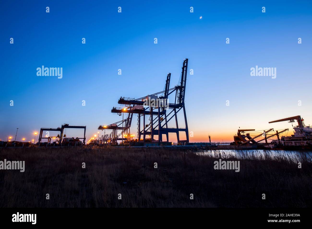Container terminal in the evening Stock Photo - Alamy