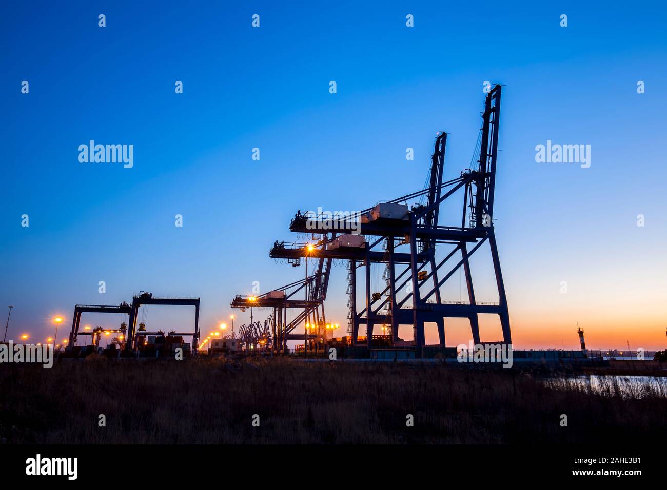 Container terminal in the evening Stock Photo - Alamy
