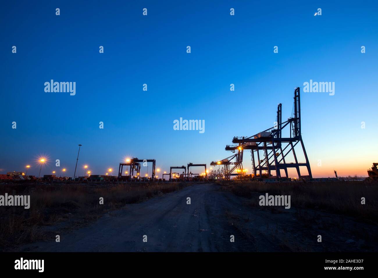 Container terminal in the evening Stock Photo - Alamy