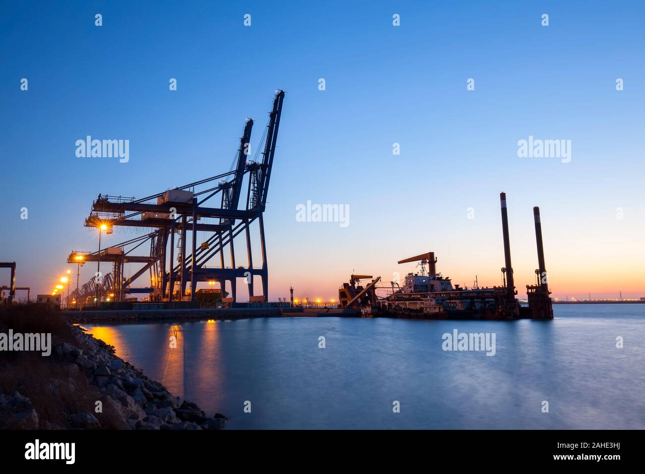 Container terminal in the evening Stock Photo - Alamy