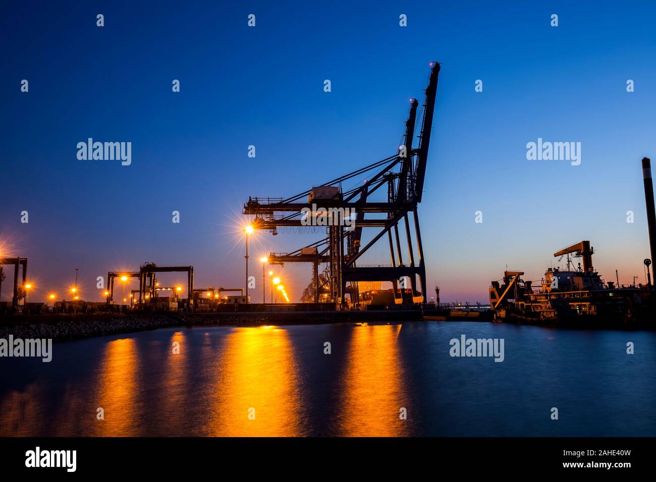Container terminal in the evening Stock Photo - Alamy