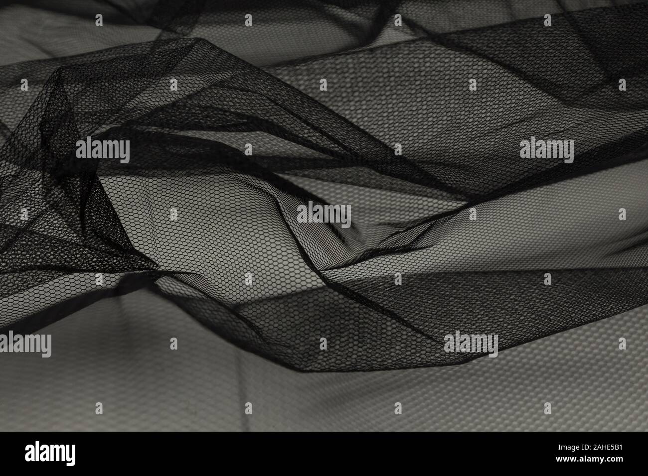 Beautiful close up of black tulle fabric with textile texture ...