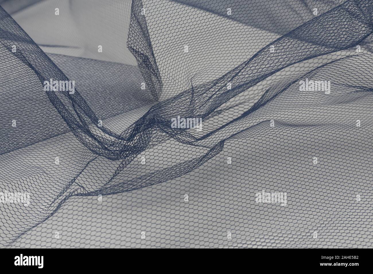 Beautiful close up of blue tulle fabric with textile texture background ...