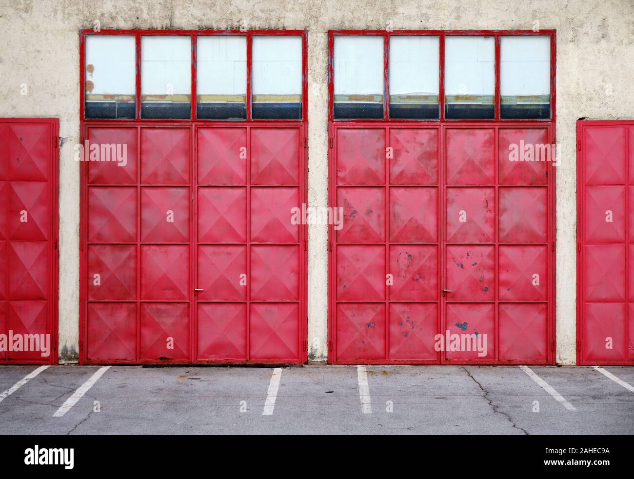 Old disused fire station red metal doors, all made of individual ...