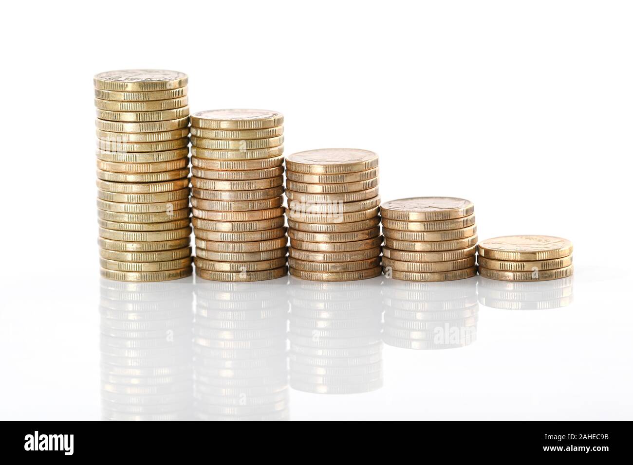A stack of Australian one dollar gold coins set against a white ...