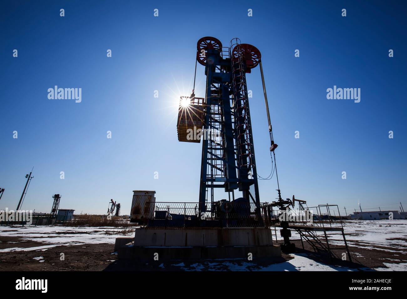 Oil field scene,Tower type pumping unit under the blue sky Stock Photo ...