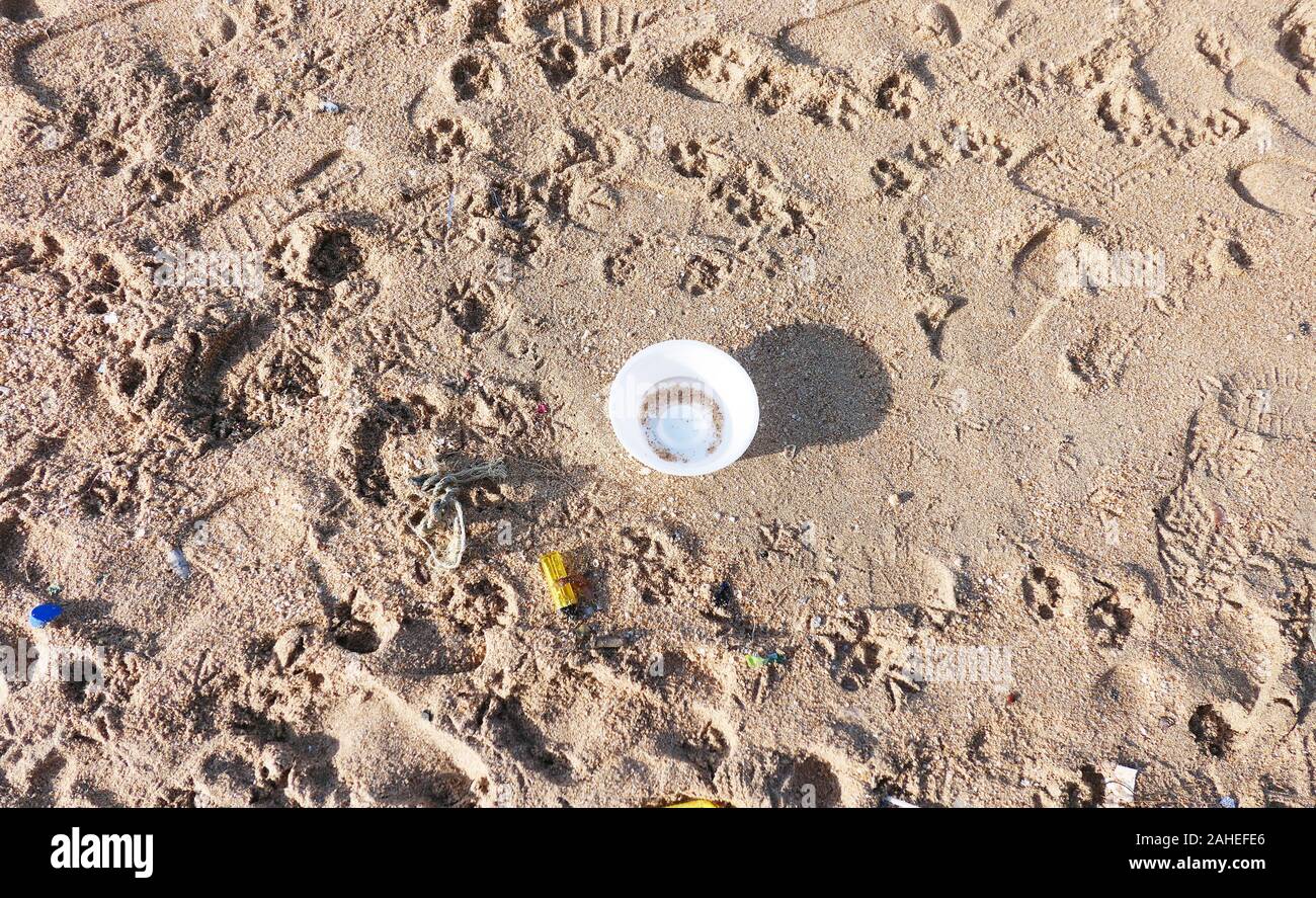 Trash on the beach Stock Photo - Alamy