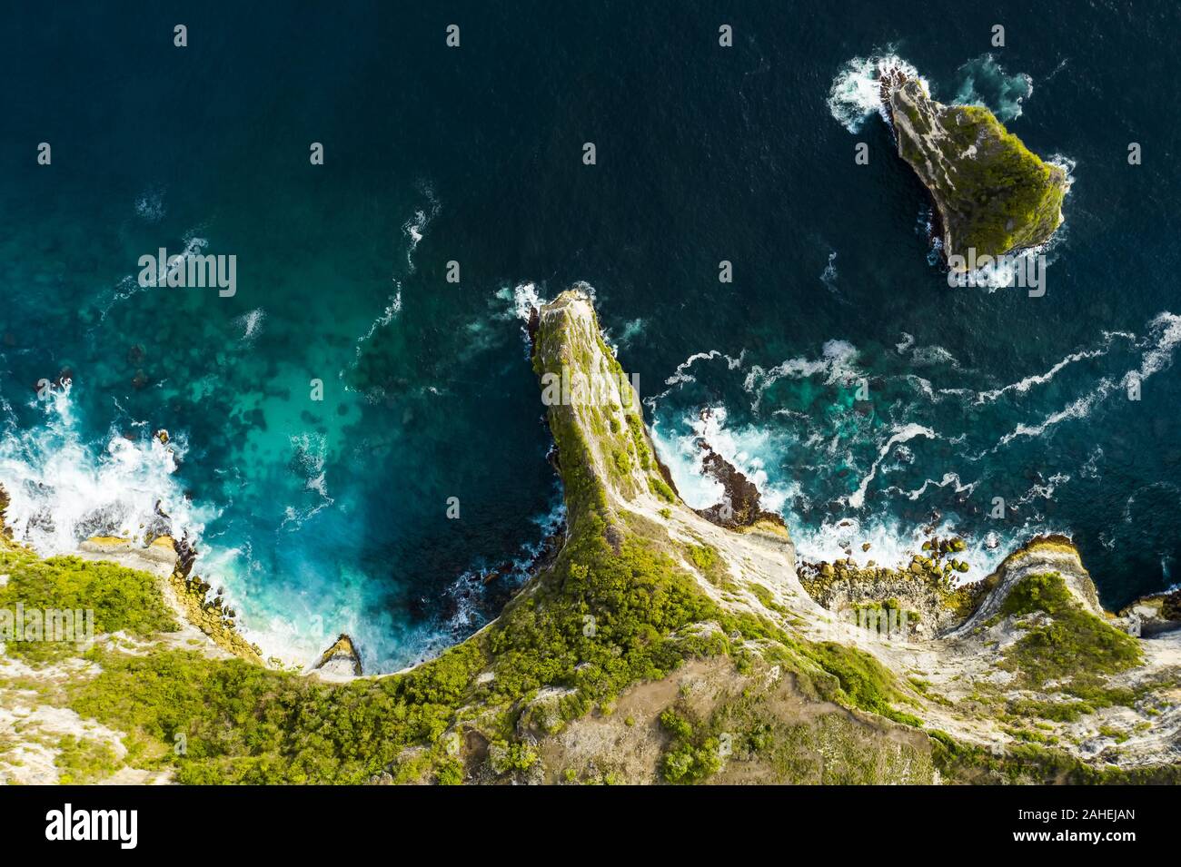 View from above, stunning aerial view of a green limestone cliff bathed ...