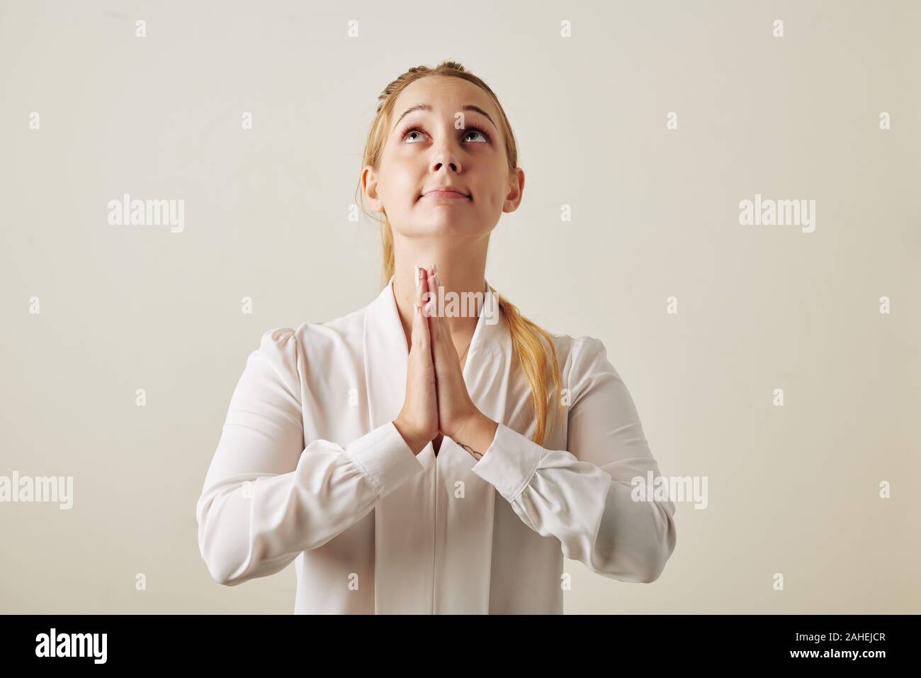 One woman praying looking up hi-res stock photography and images - Alamy