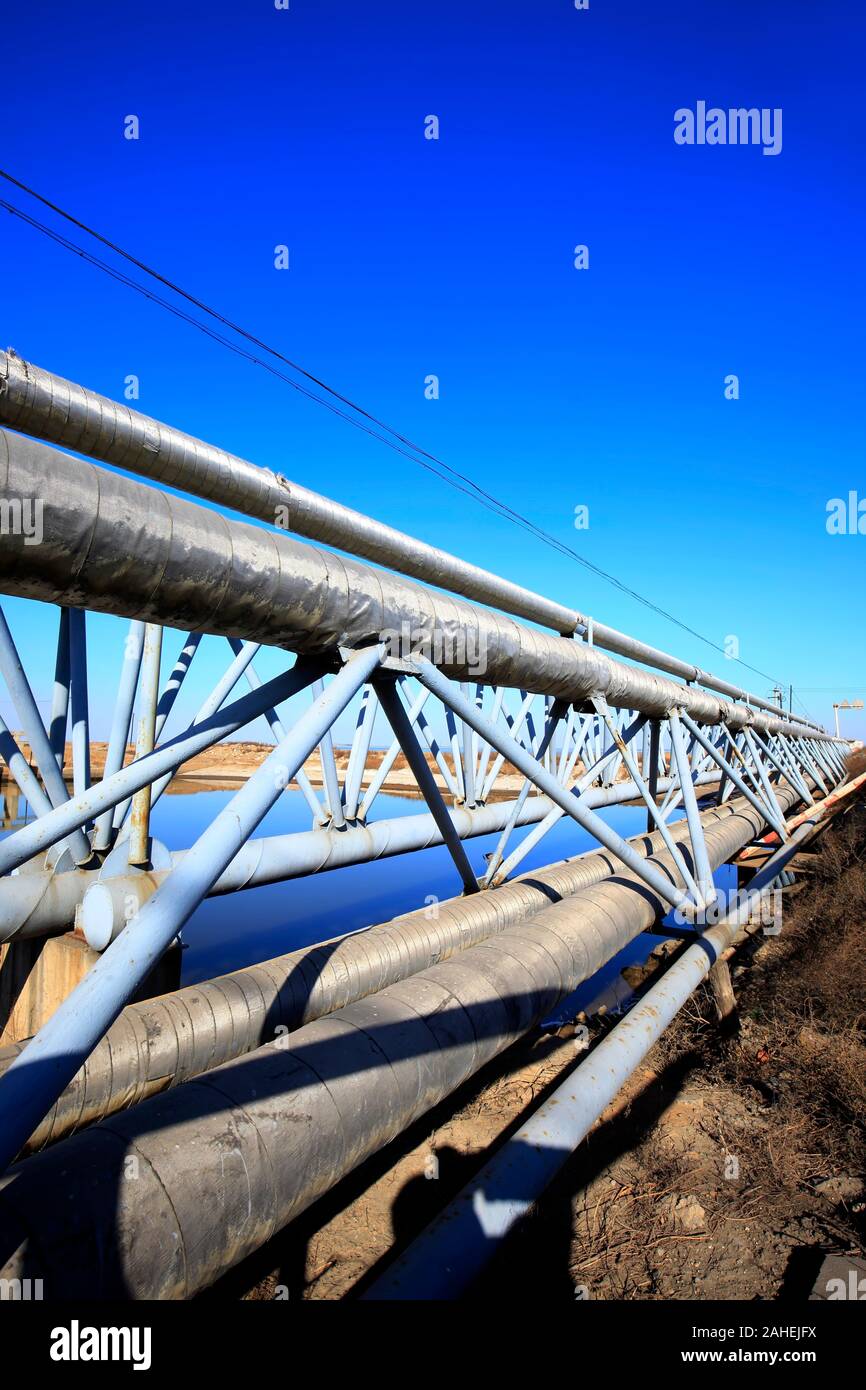 Oil field scene, oil pipelines and facilities Stock Photo - Alamy