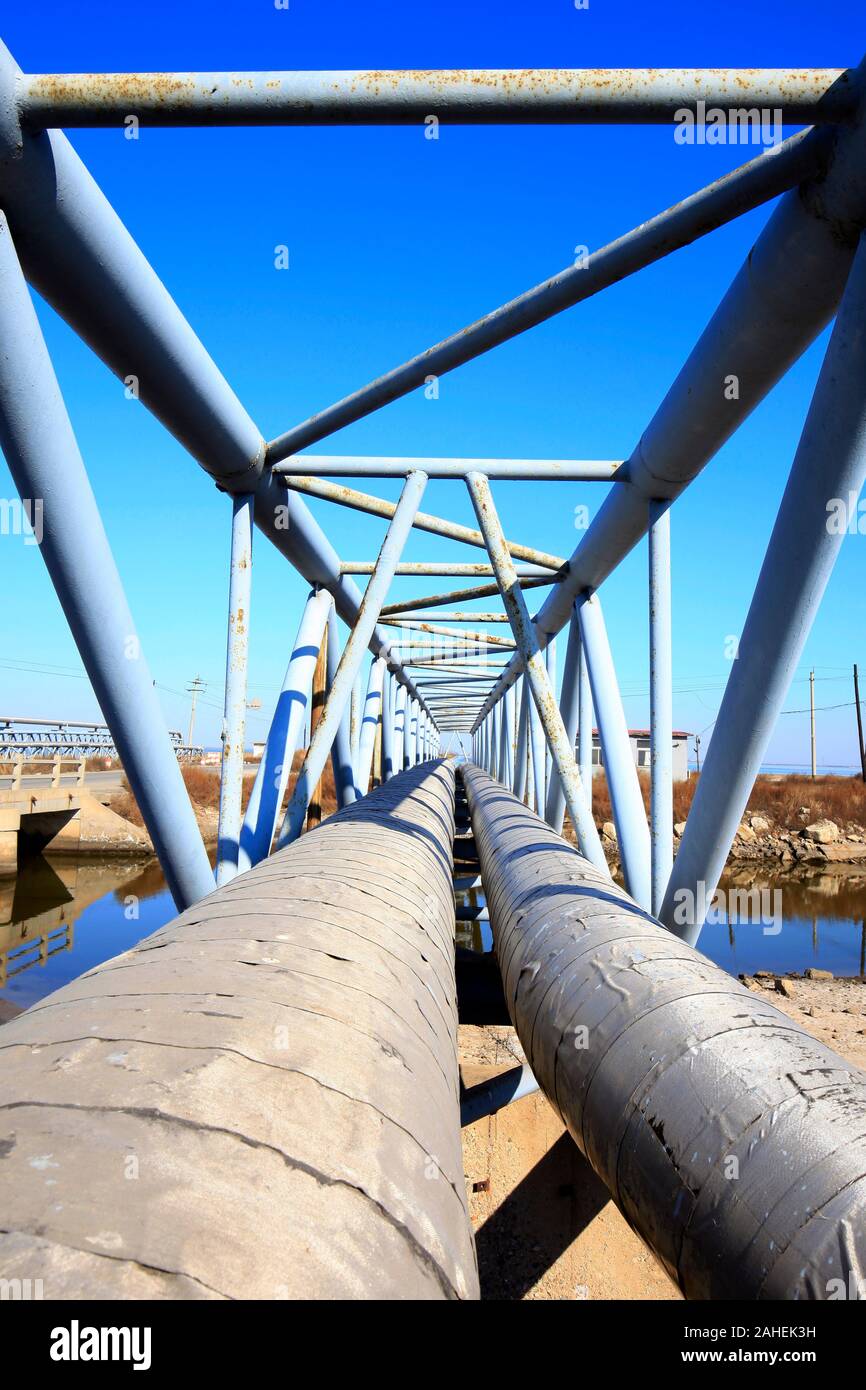 Oil field scene, oil pipelines and facilities Stock Photo - Alamy