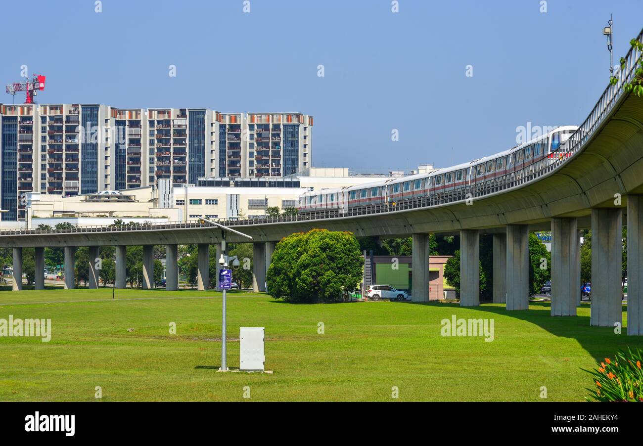 Singapore - Feb 9, 2018. Singapore MRT railway train pass though ...