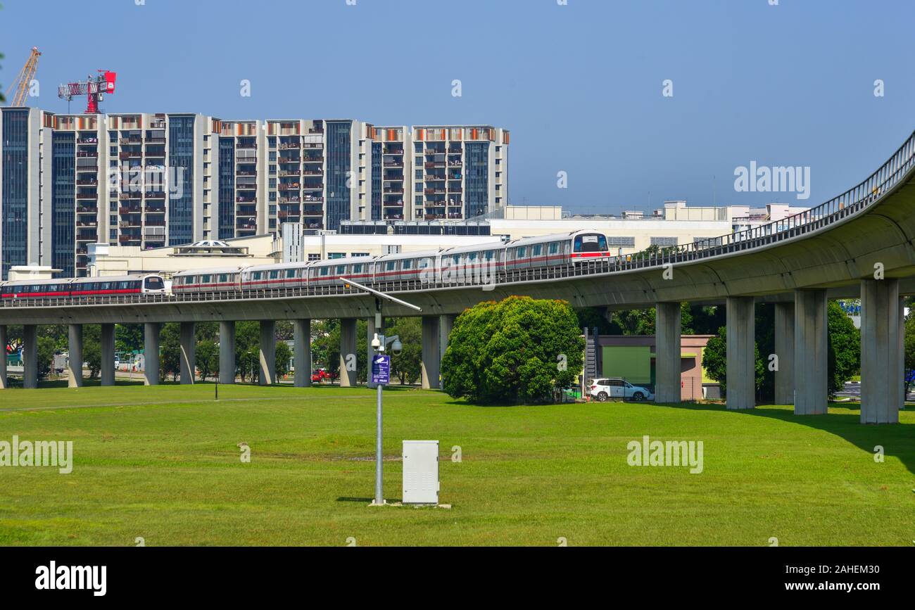 Singapore - Feb 9, 2018. Singapore MRT railway train pass though ...