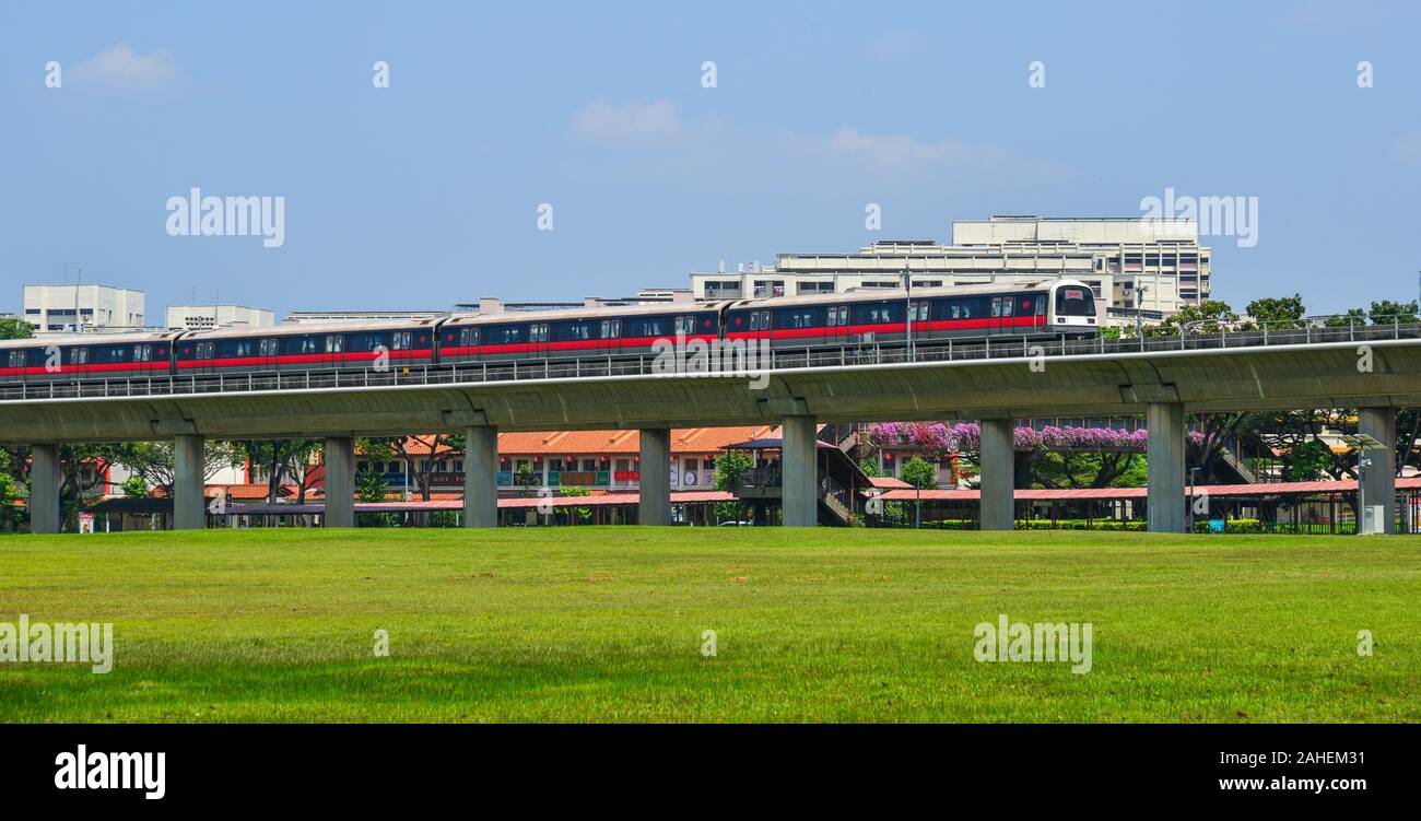 Singapore - Feb 9, 2018. Singapore MRT railway train pass though ...