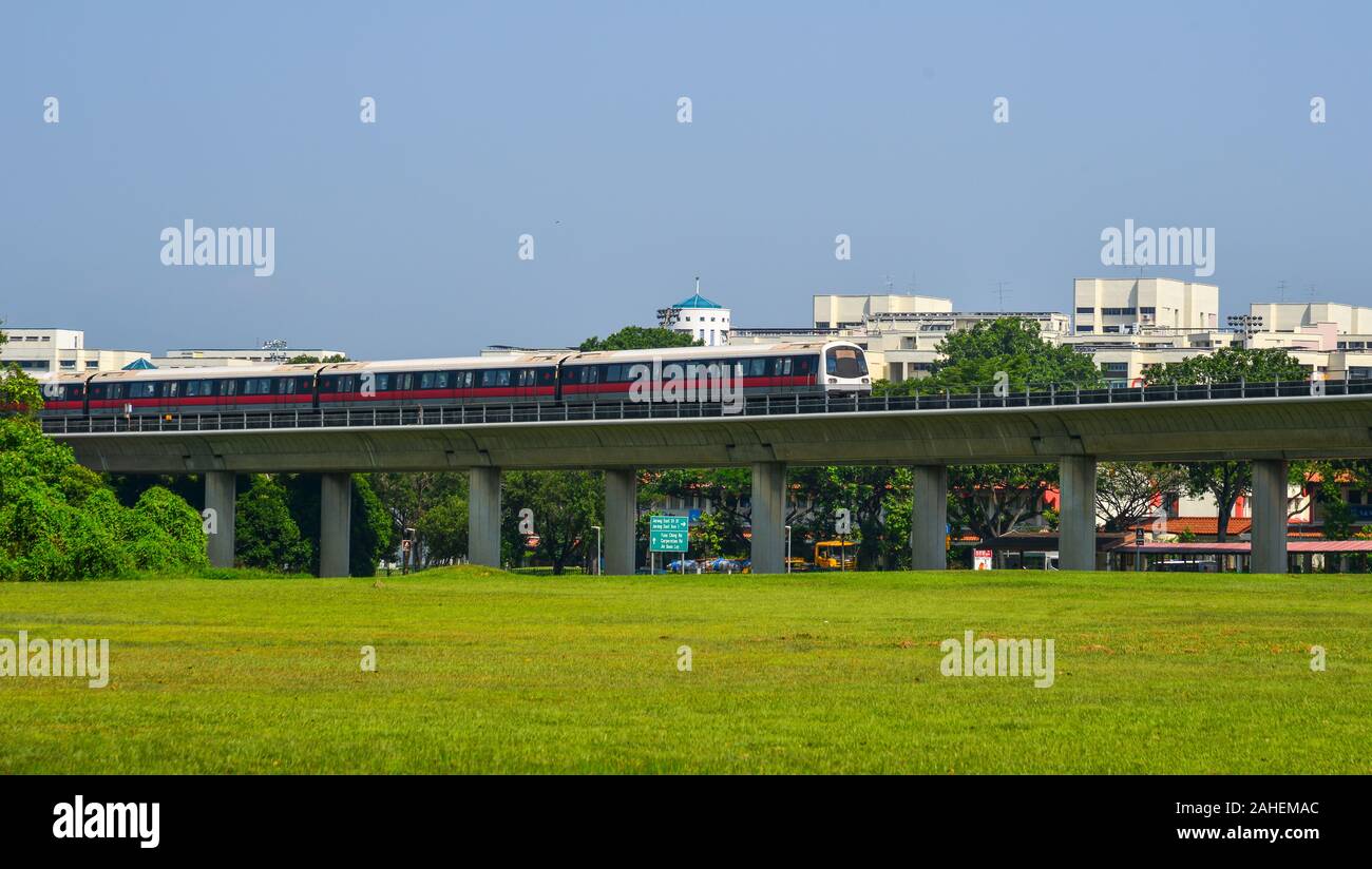 Singapore - Feb 9, 2018. Singapore MRT railway train pass though ...